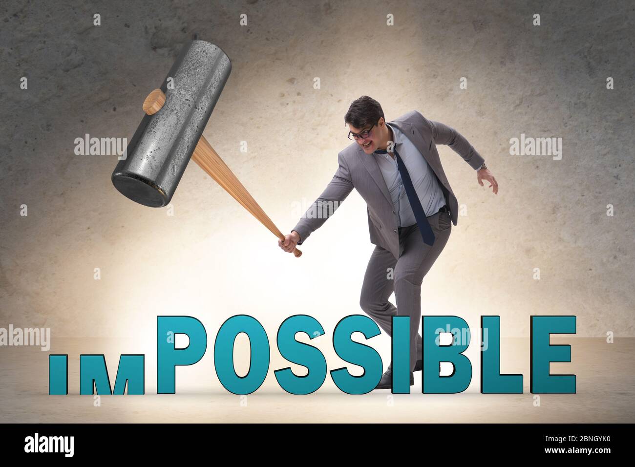 The businessman hitting the word impossible with hammer Stock Photo - Alamy
