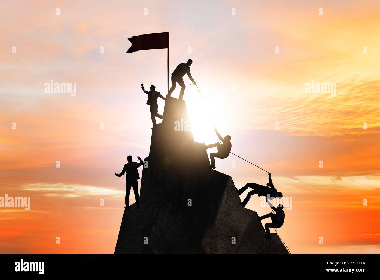 Concept of teamwork with team climbing mountain Stock Photo - Alamy
