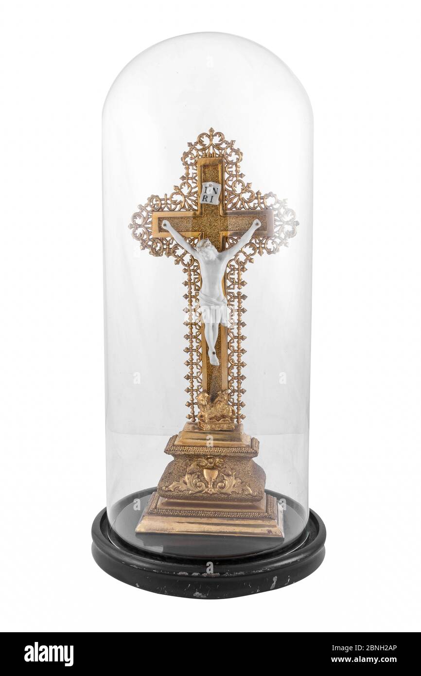 Closeup shot of a Jesus Christ cross statue in glass cover isolated on a white background Stock ...