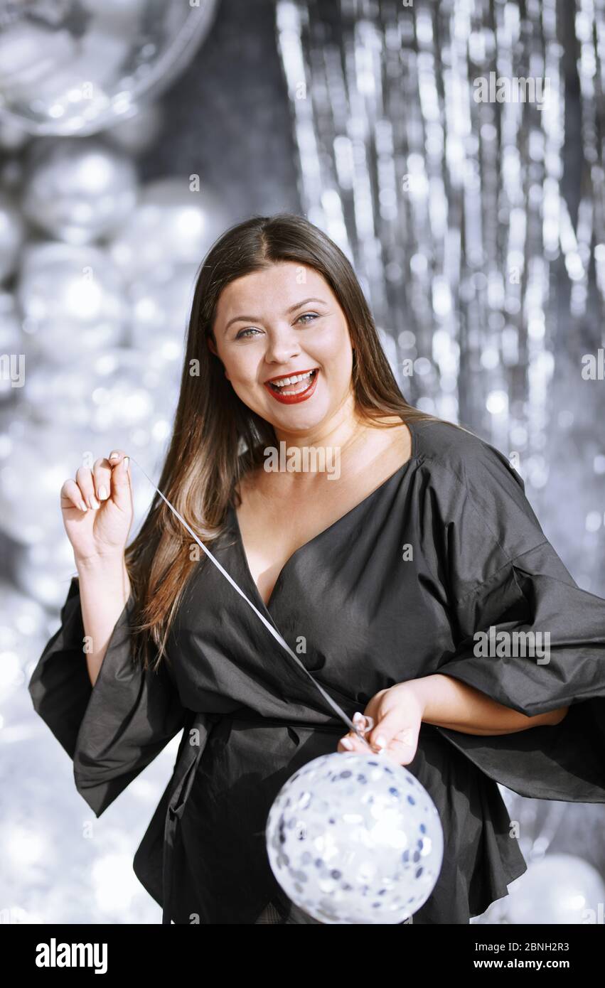 Happy plus size woman at the party Stock Photo - Alamy