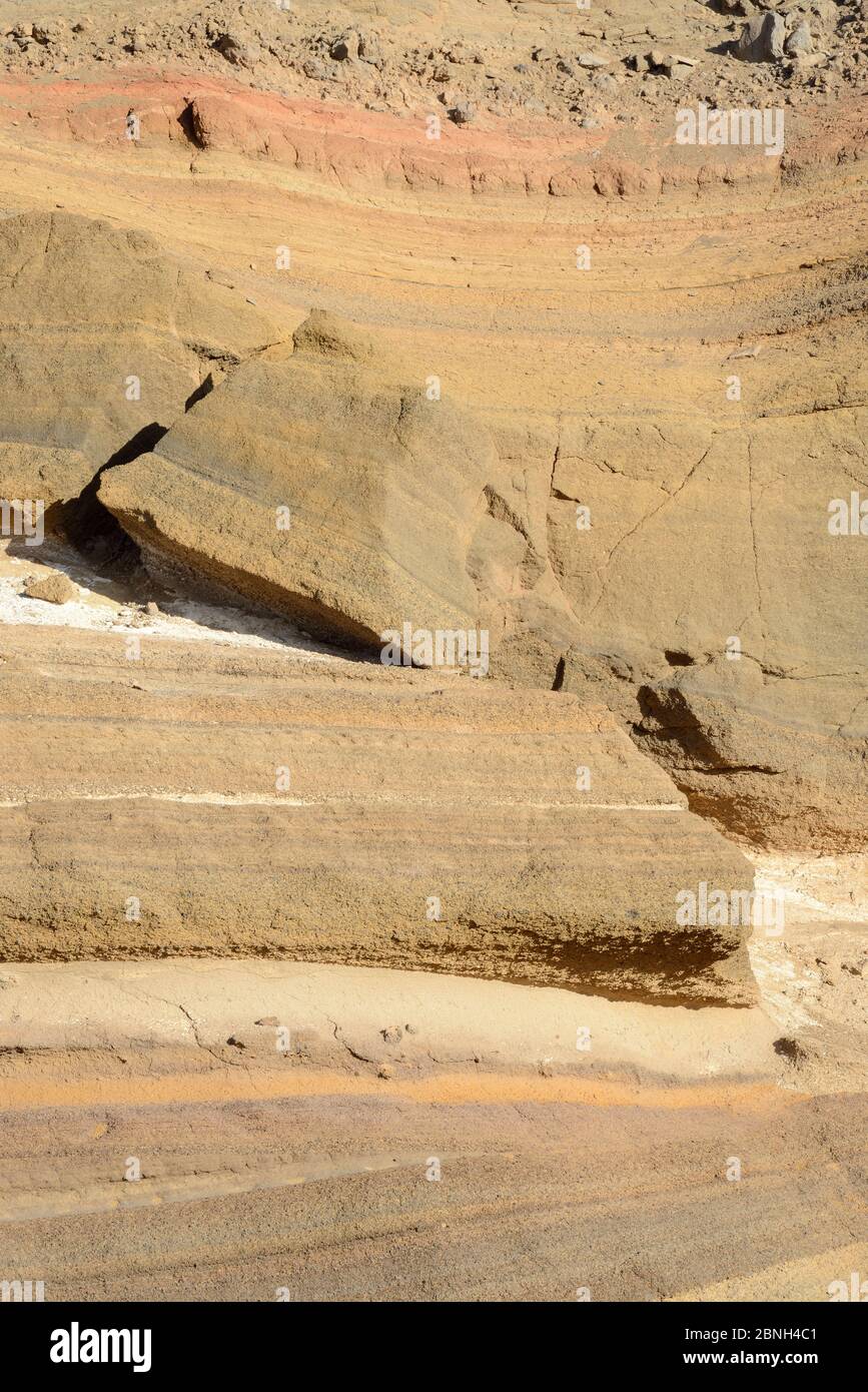 Volcanic rocks with layers formed by layers of volcanic ash, pumice and lava from successive ...