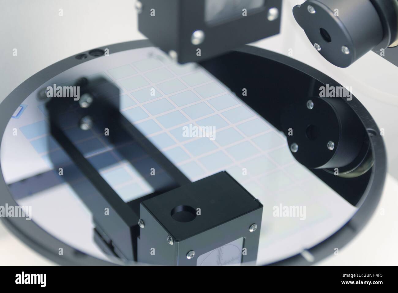 Ellipsometer tool in a laboratory. Silicon wafer of purple color ...