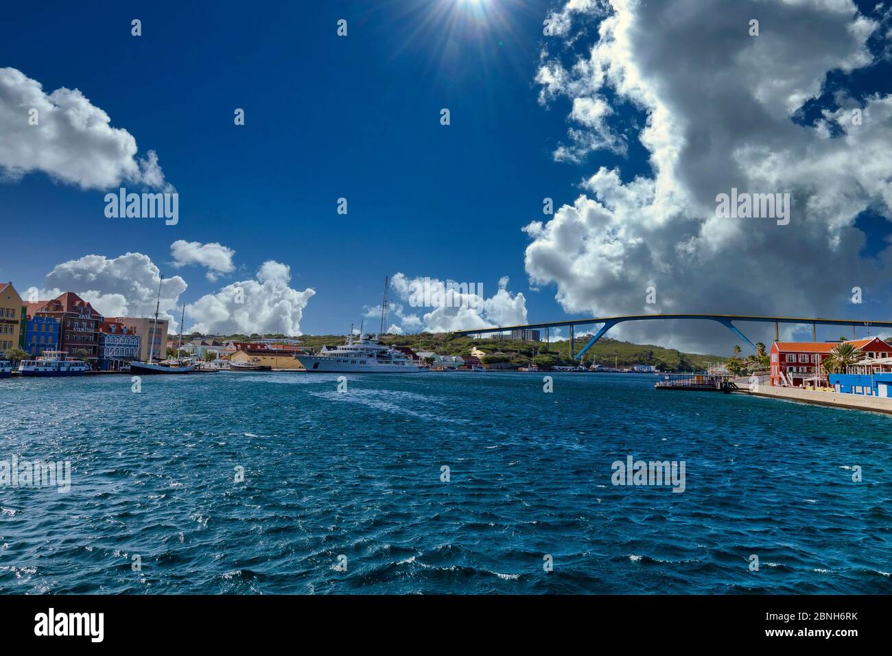 Massive Yacht by Queens Bridge in Sunny Curacao Stock Photo - Alamy