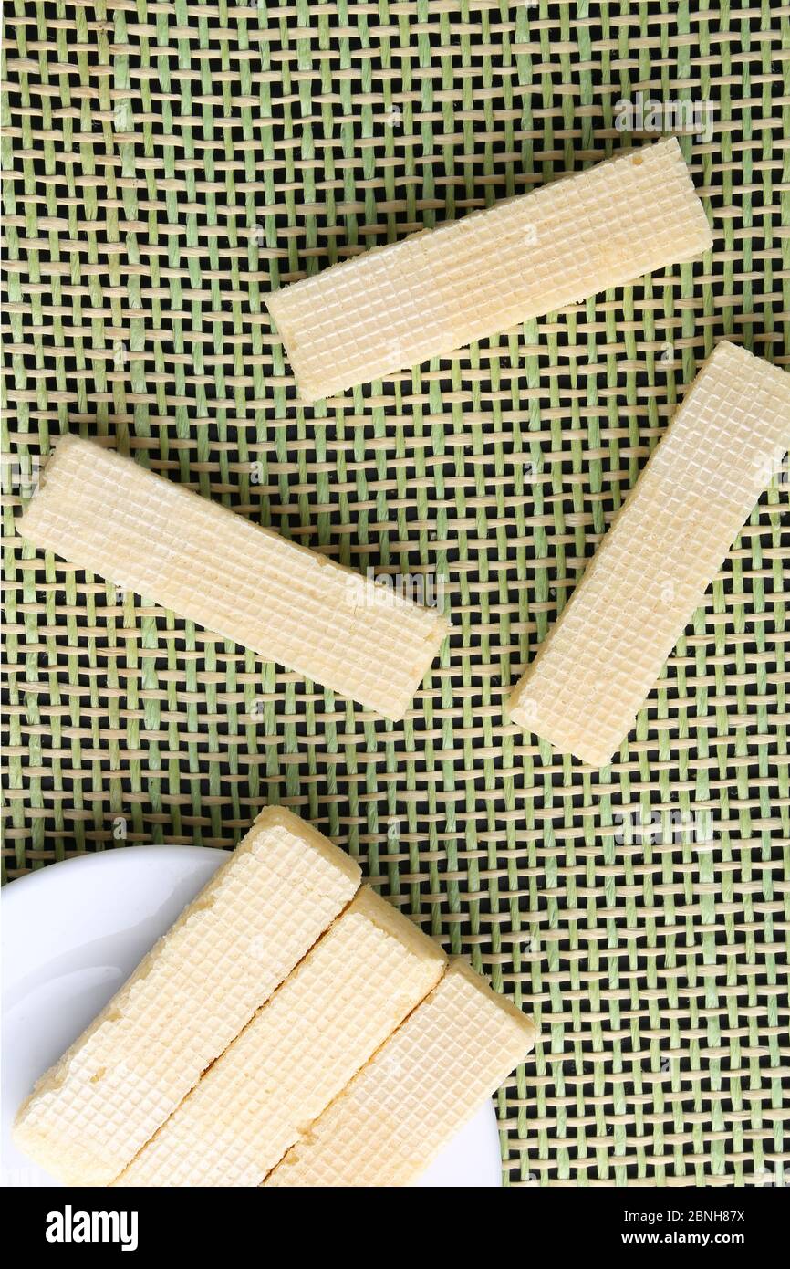 Tasty wafer sticks on Blue background, flat lay. Sweet food Stock Photo ...