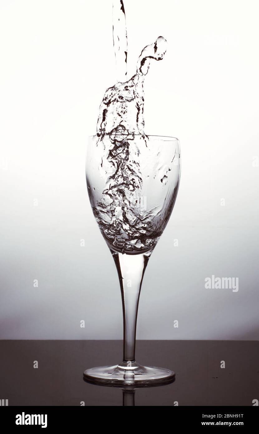 Apple juice splash on black background Stock Photo - Alamy