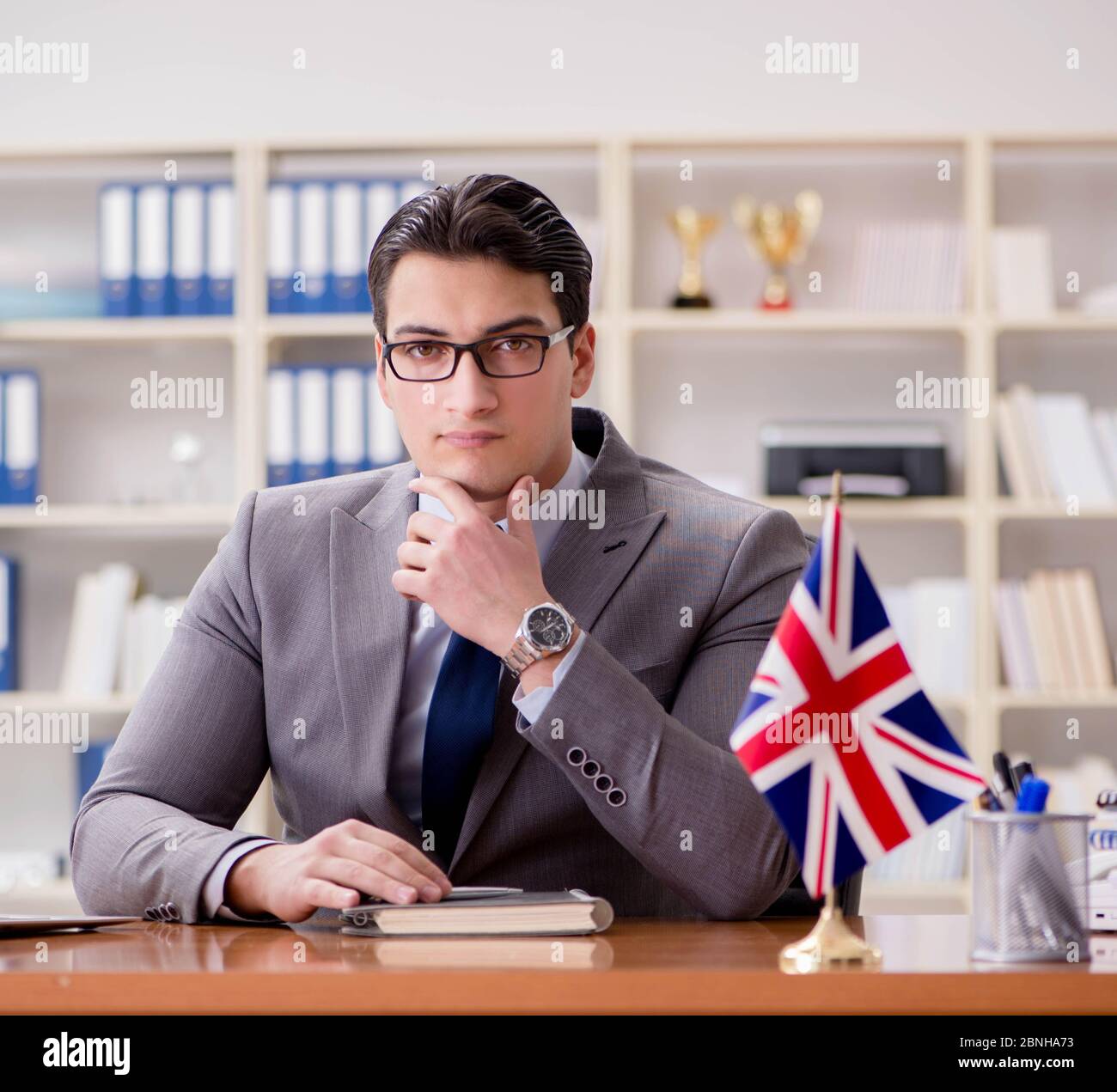 The businessman with british flag in the office Stock Photo - Alamy