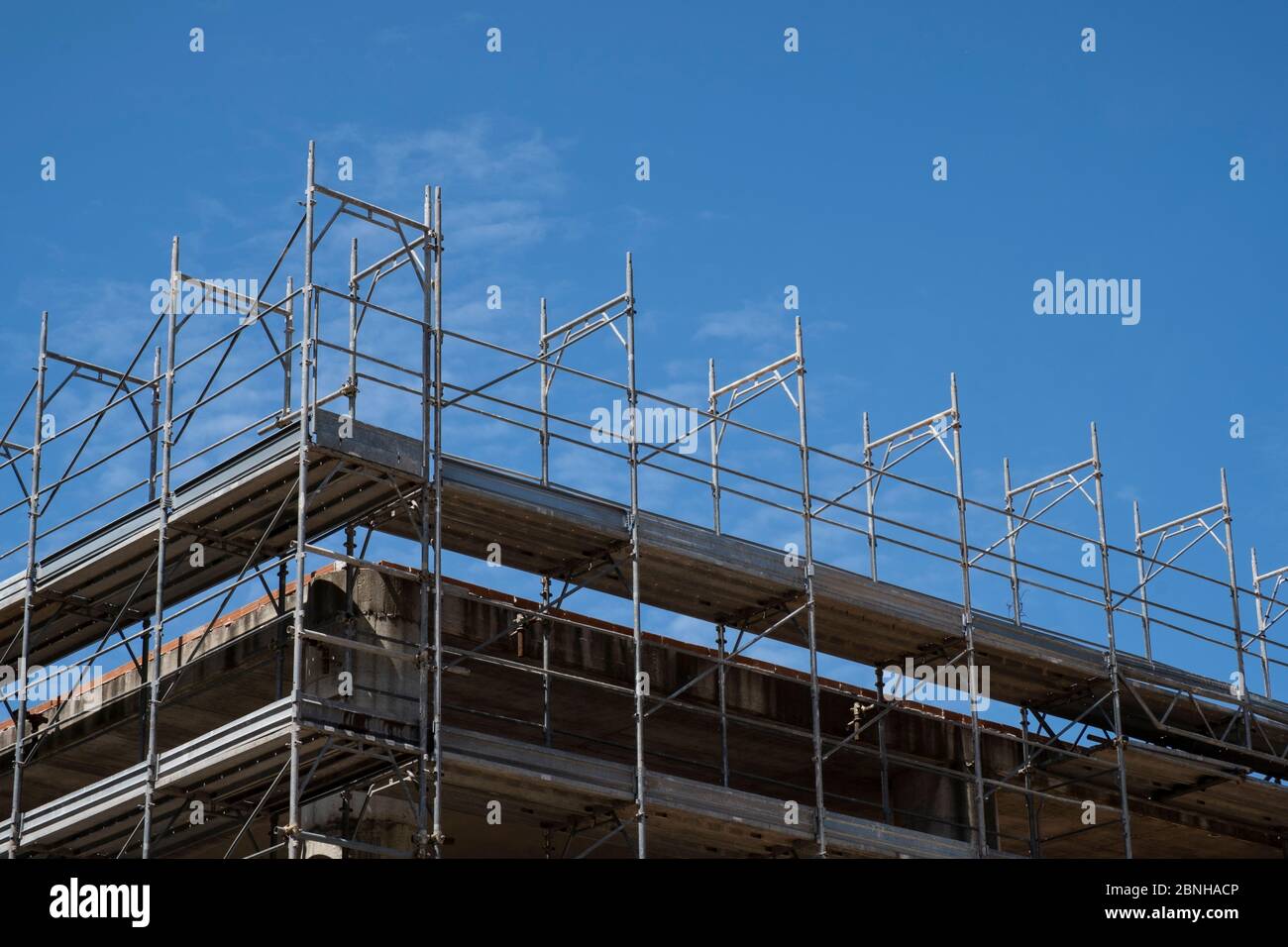 scaffolding building construction site against blue sky Stock Photo - Alamy