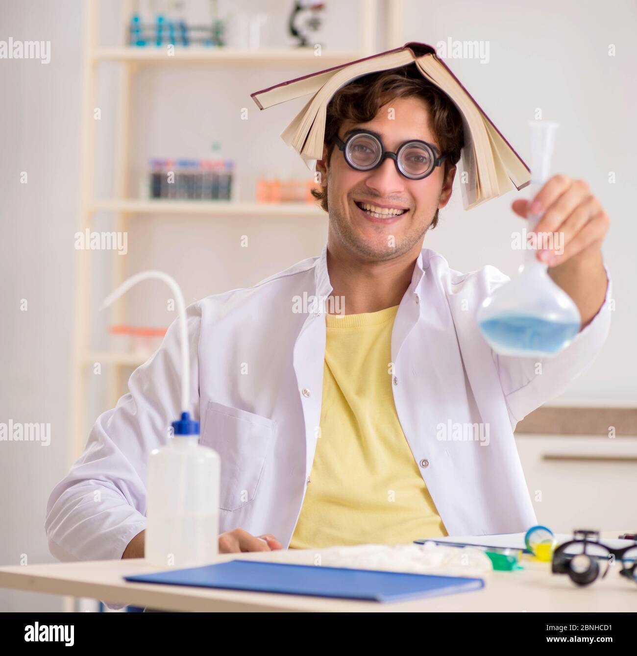 The funny crazy chemist doing experiments and tests Stock Photo - Alamy