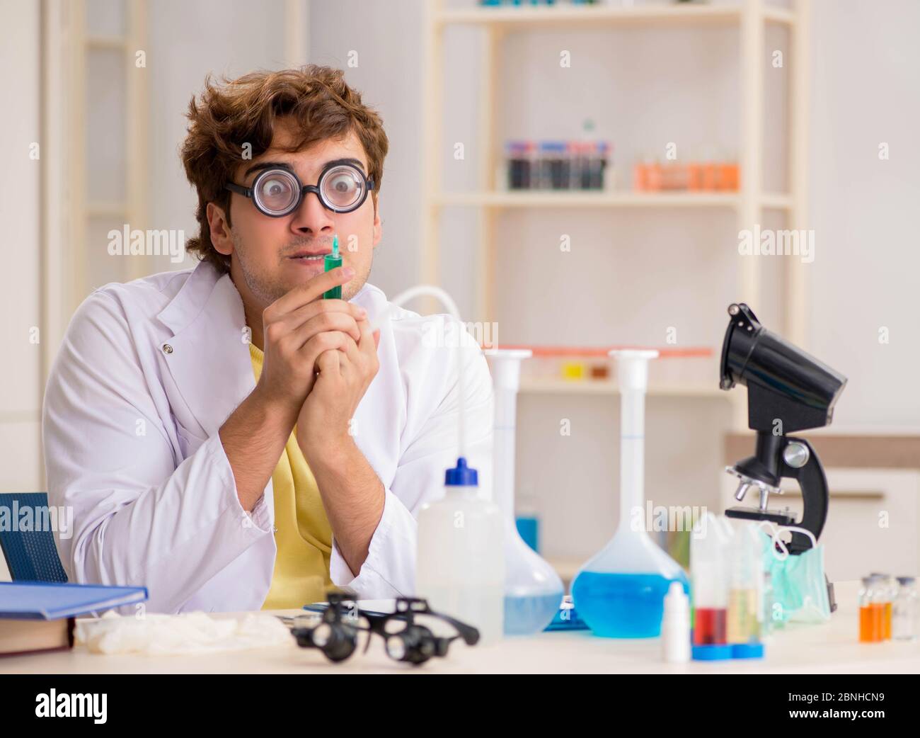 The funny crazy chemist doing experiments and tests Stock Photo - Alamy