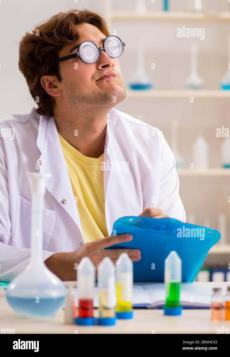 The funny crazy chemist doing experiments and tests Stock Photo - Alamy