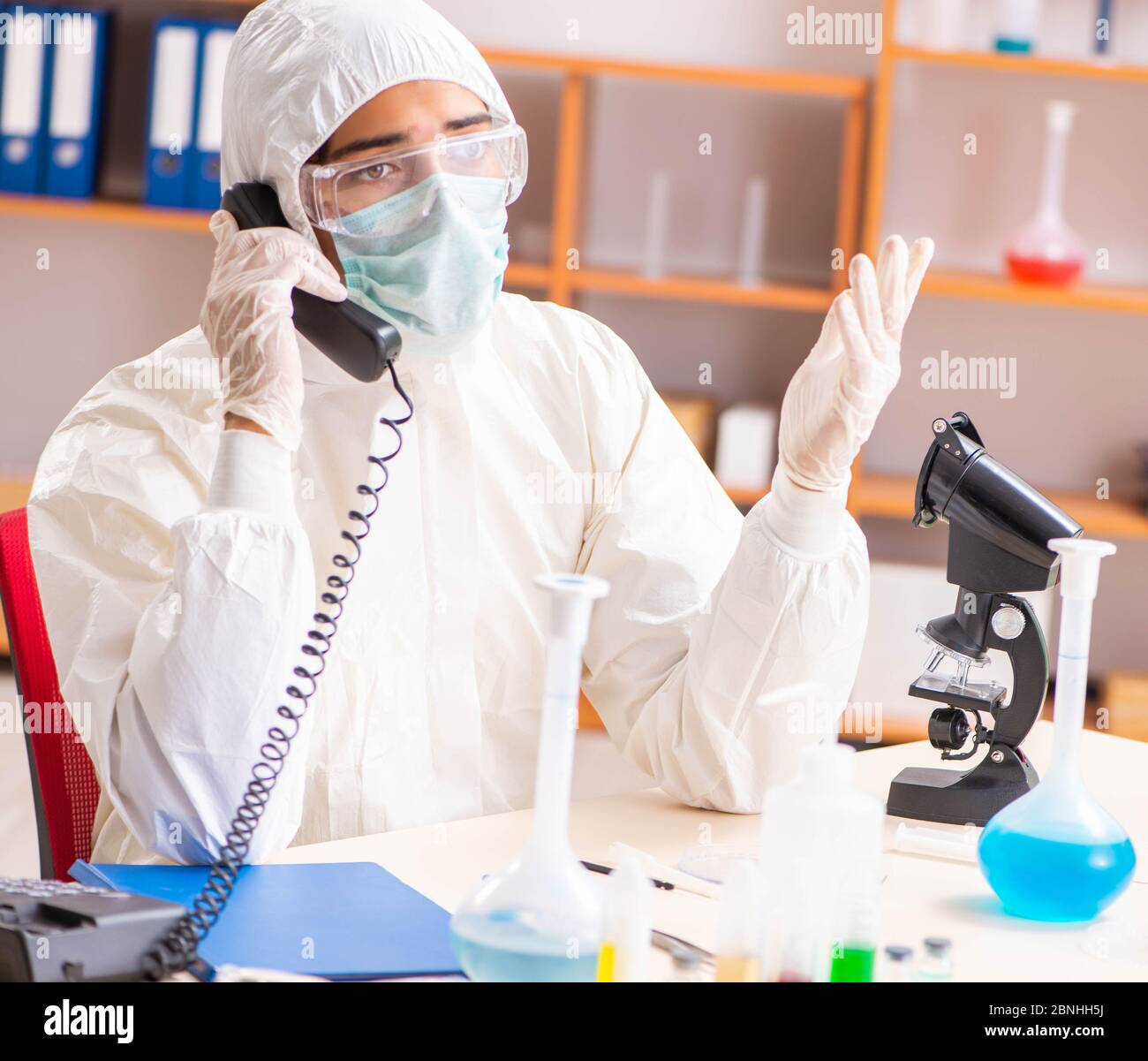 The young biochemist wearing protective suit working in the lab Stock ...