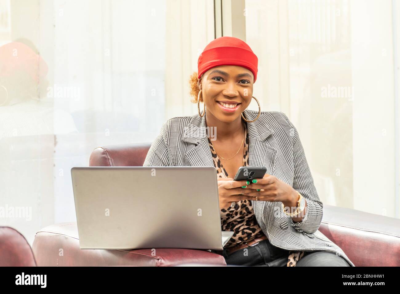 beautiful young african muslim business woman using her laptop computer ...