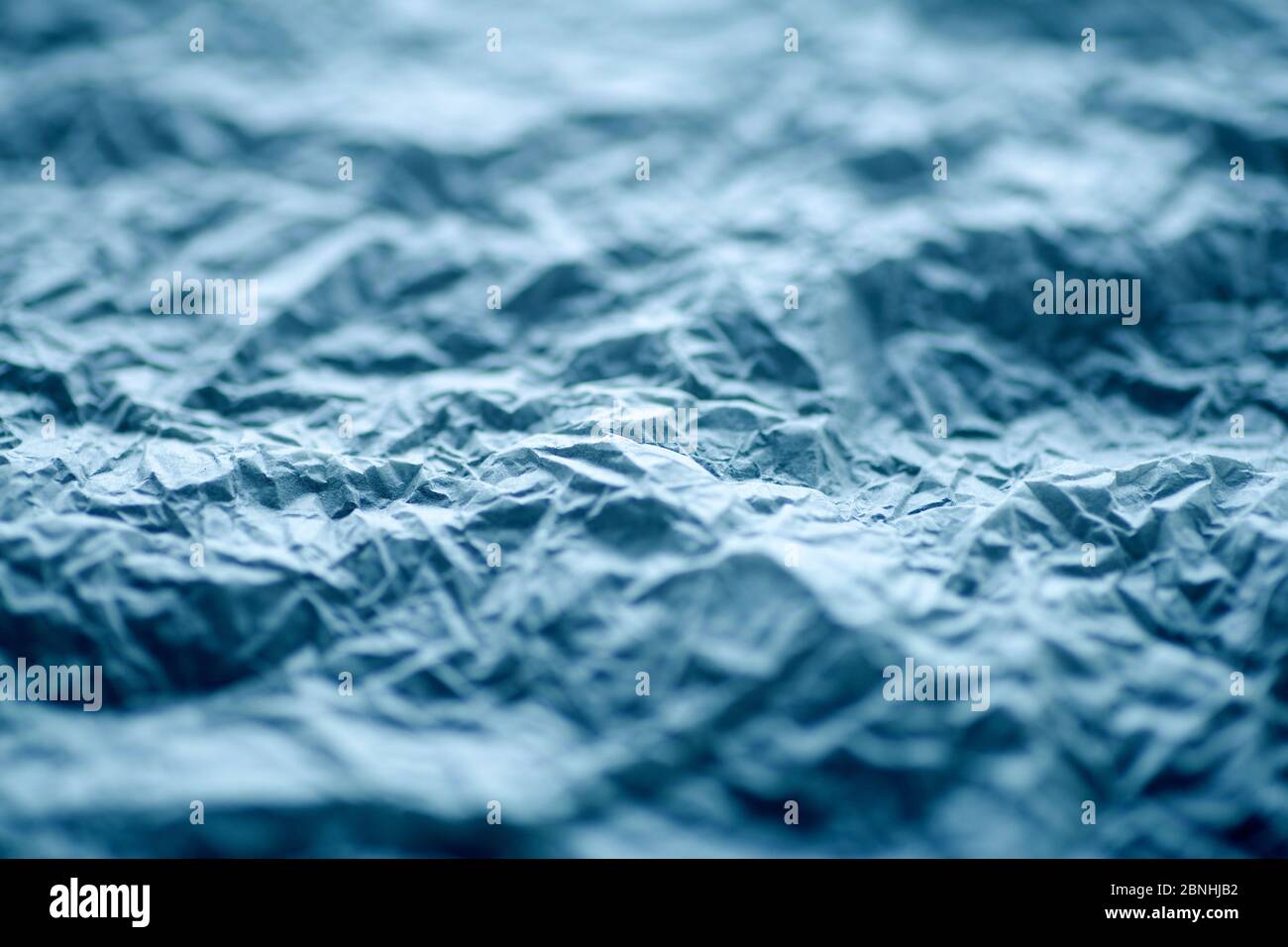 The structure of crumpled paper. Crumpled blue paper pattern and ...