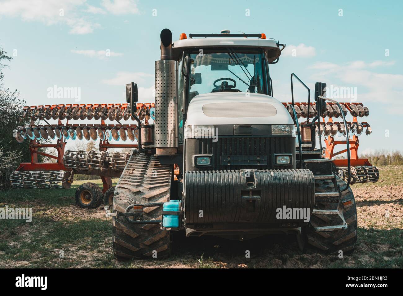 Crawler tractor cultivating field hi-res stock photography and images ...