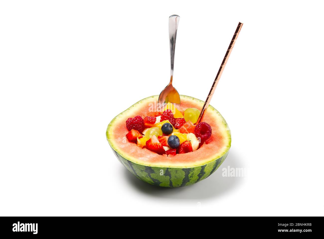 Watermelon filled with fresh fruit salad. isolated on white background ...