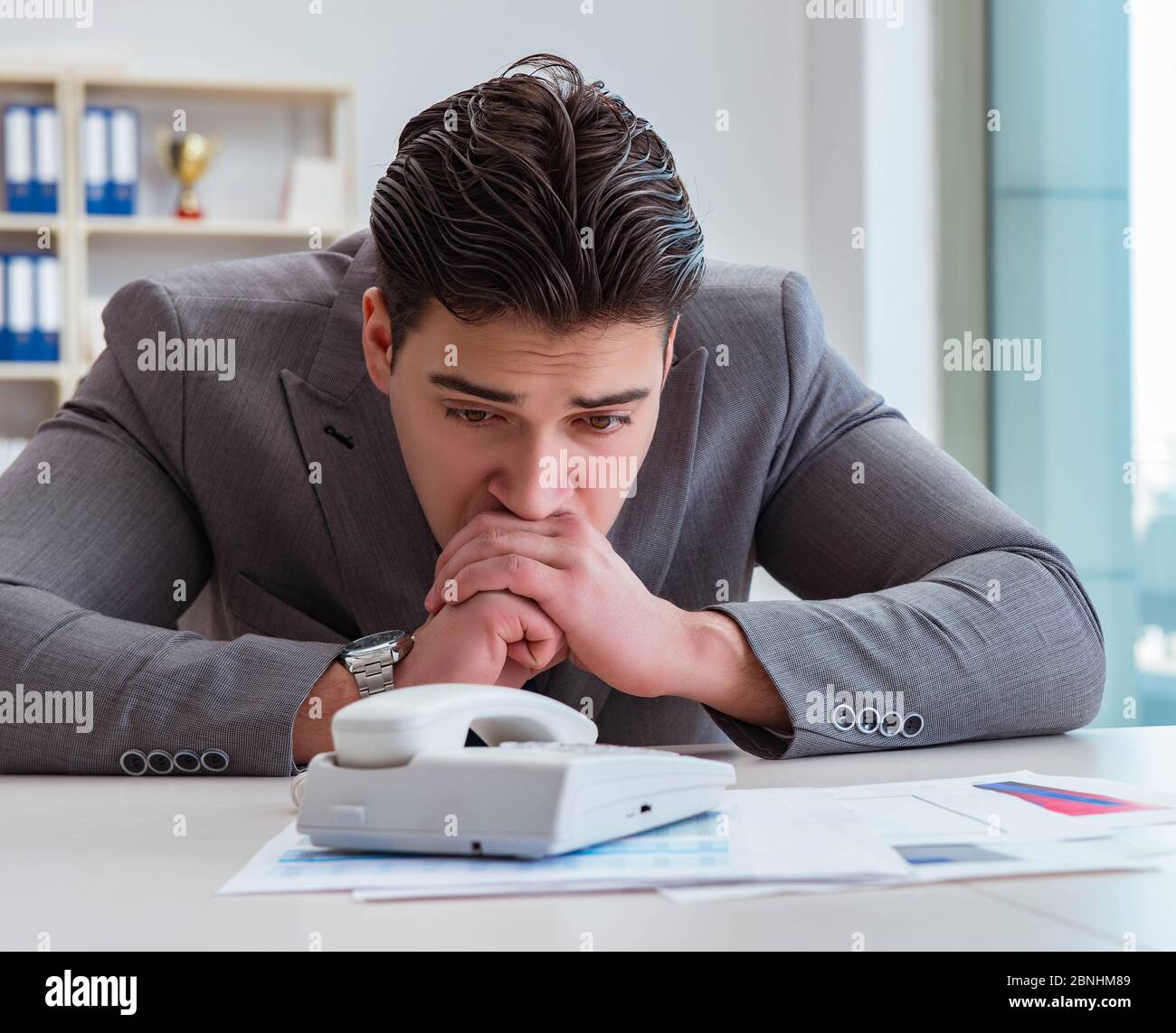 The businessman expecting important call on phone Stock Photo - Alamy