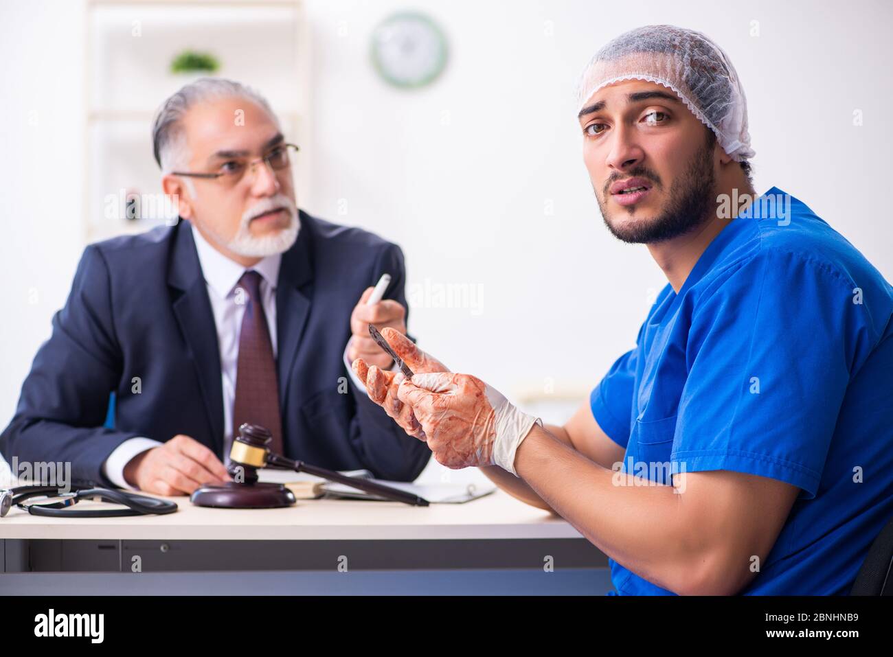 Doctor in courthouse meeting with advocate Stock Photo - Alamy