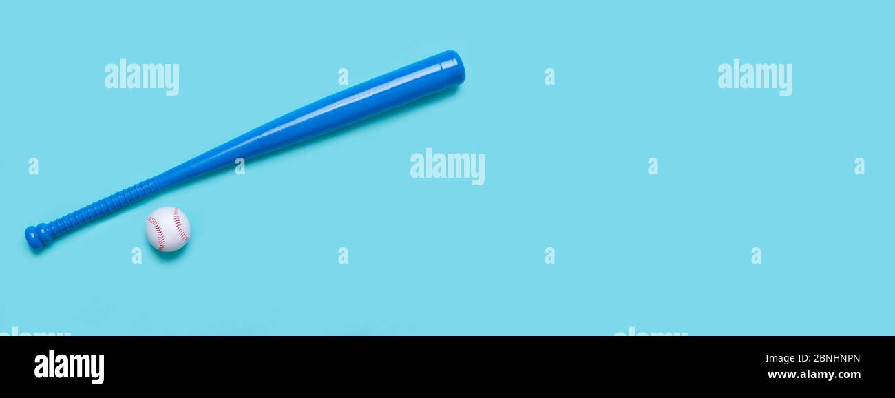 Blue baseball bat and ball isolated on blue background Stock Photo - Alamy