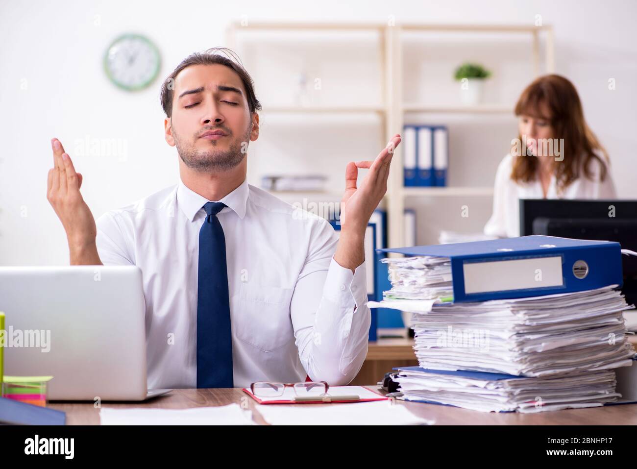 Office employees meditating in hi-res stock photography and images - Alamy