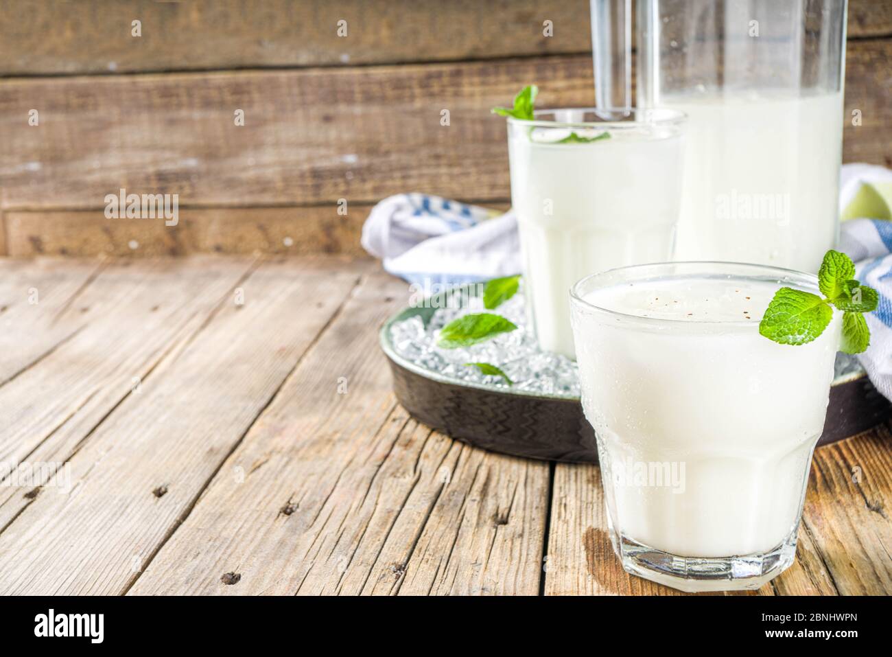 Cold Indian drink Lassi, iced coconut Lassi drink with mint leaf ...