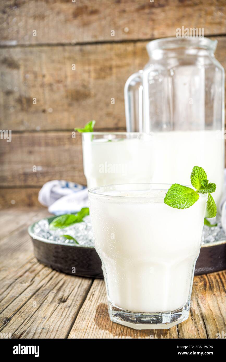 Cold Indian drink Lassi, iced coconut Lassi drink with mint leaf ...