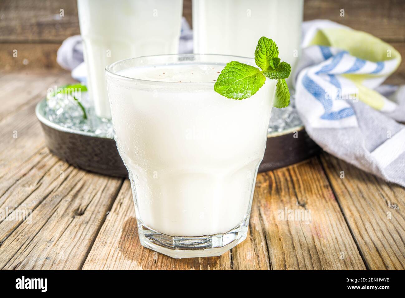 Cold Indian drink Lassi, iced coconut Lassi drink with mint leaf ...