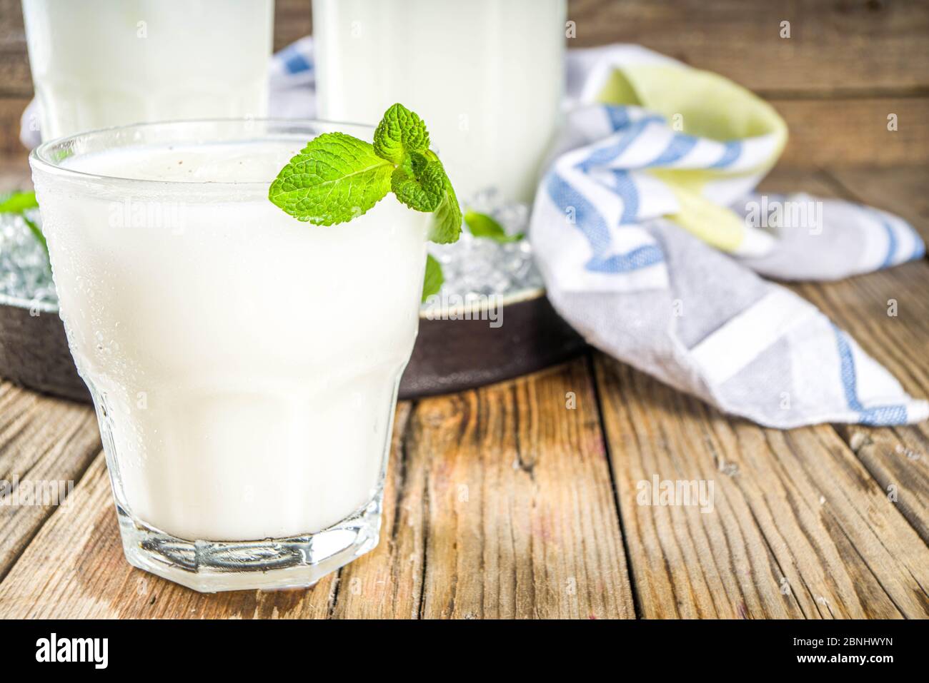 Cold Indian drink Lassi, iced coconut Lassi drink with mint leaf ...