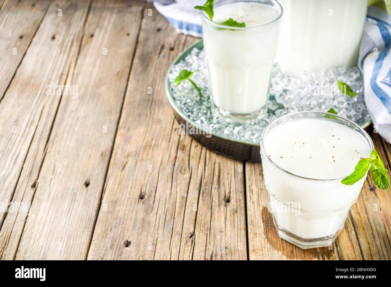 Cold Indian drink Lassi, iced coconut Lassi drink with mint leaf ...