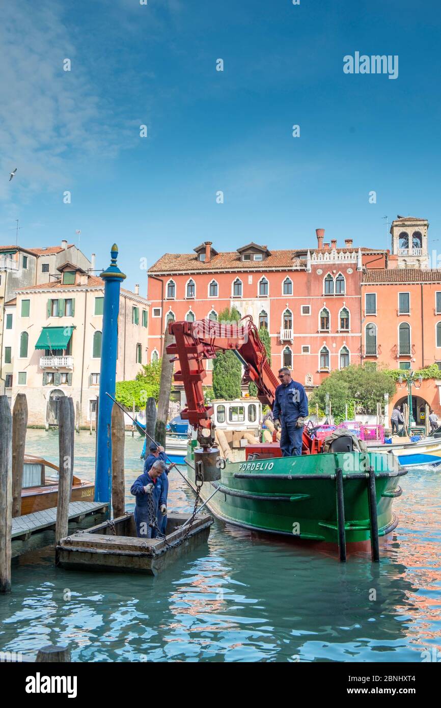 Maintenance barge repairing mooring posts on Grand Canal, Venice, Italy ...