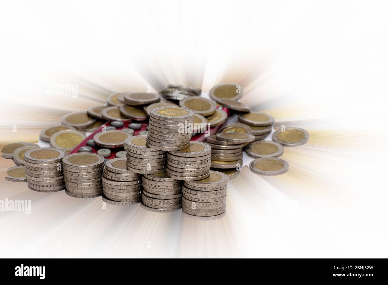 two euro coin money stack with calculator and light beams Stock Photo ...