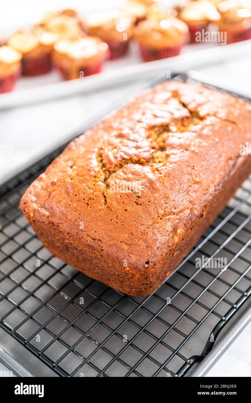 Cooling freshly baked banana nut bread loaf Stock Photo - Alamy