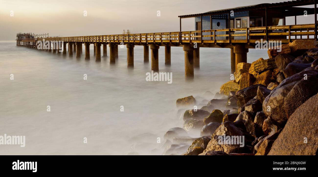 Jetty long exposure image with milky water Stock Photo - Alamy