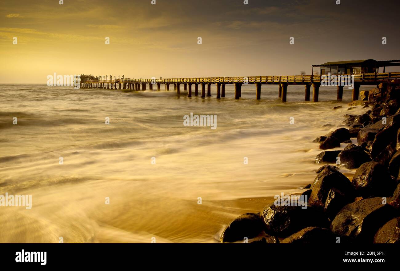 Jetty long exposure image with milky water Stock Photo - Alamy