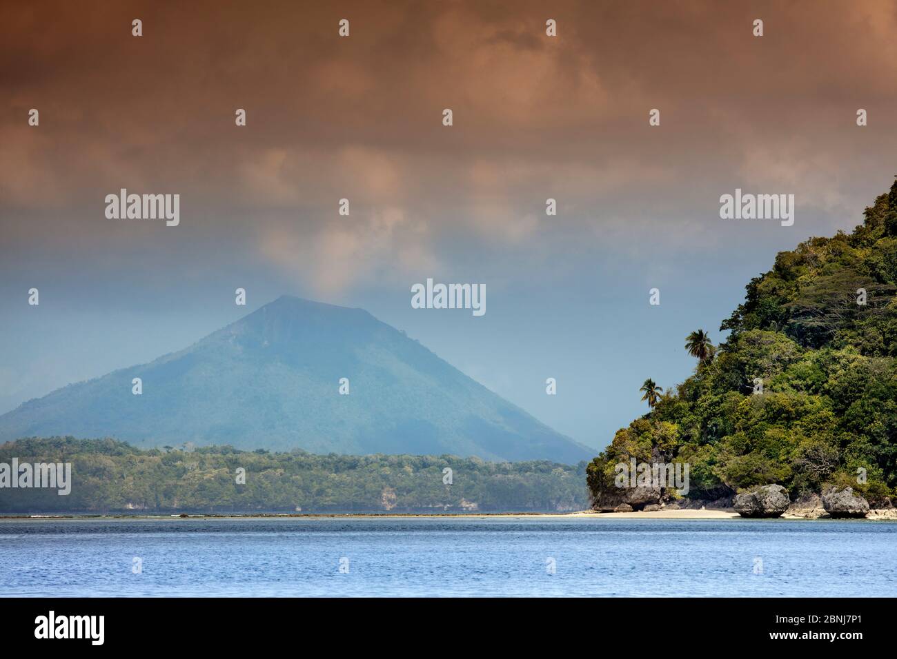 View of the cone of Gunung Api Wetar volcano from Nailaka island, Banda ...