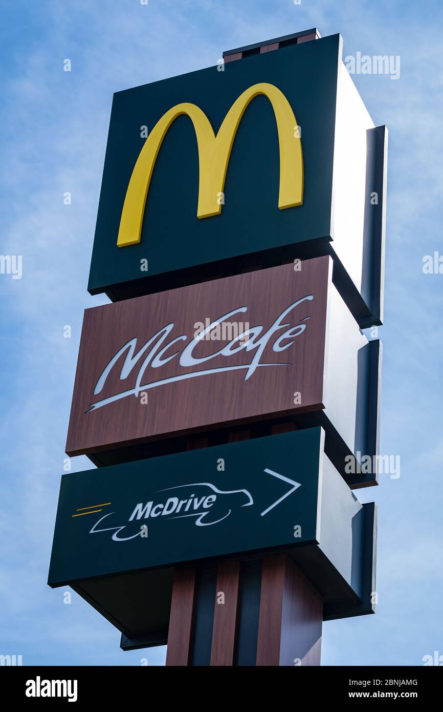 McDonald's and McCafe logos outside fast-food hamburger restaurant in ...
