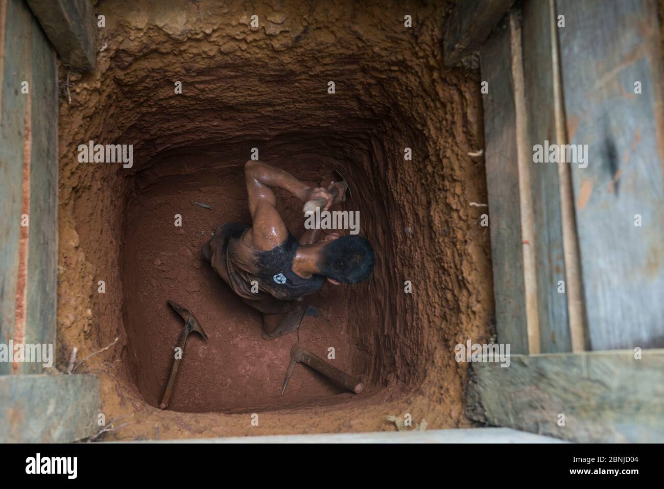 Man digging well by hand, Wai Wai territory, region 9, Parabara, Guyana ...
