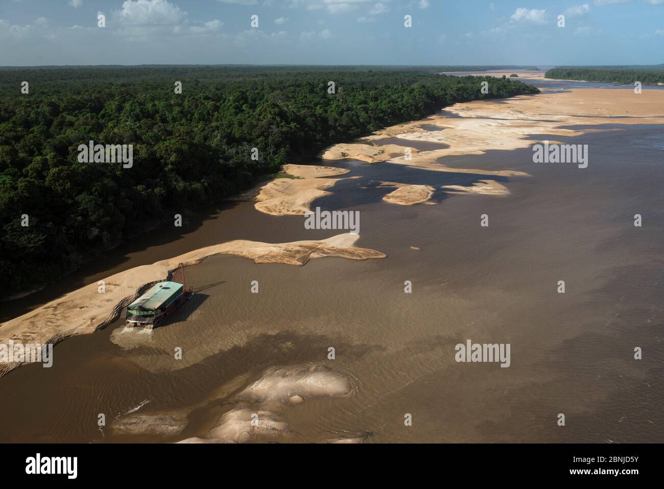Gold dredger on Essequibo river, the longest river in Guyana, South ...