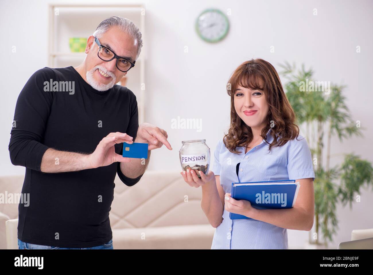 Financial advisor giving retirement advice to man Stock Photo - Alamy