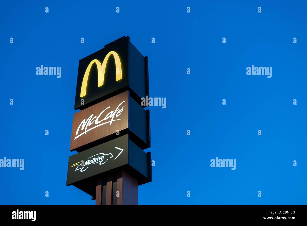 McDonald's and McCafe logos outside fast-food hamburger restaurant at ...