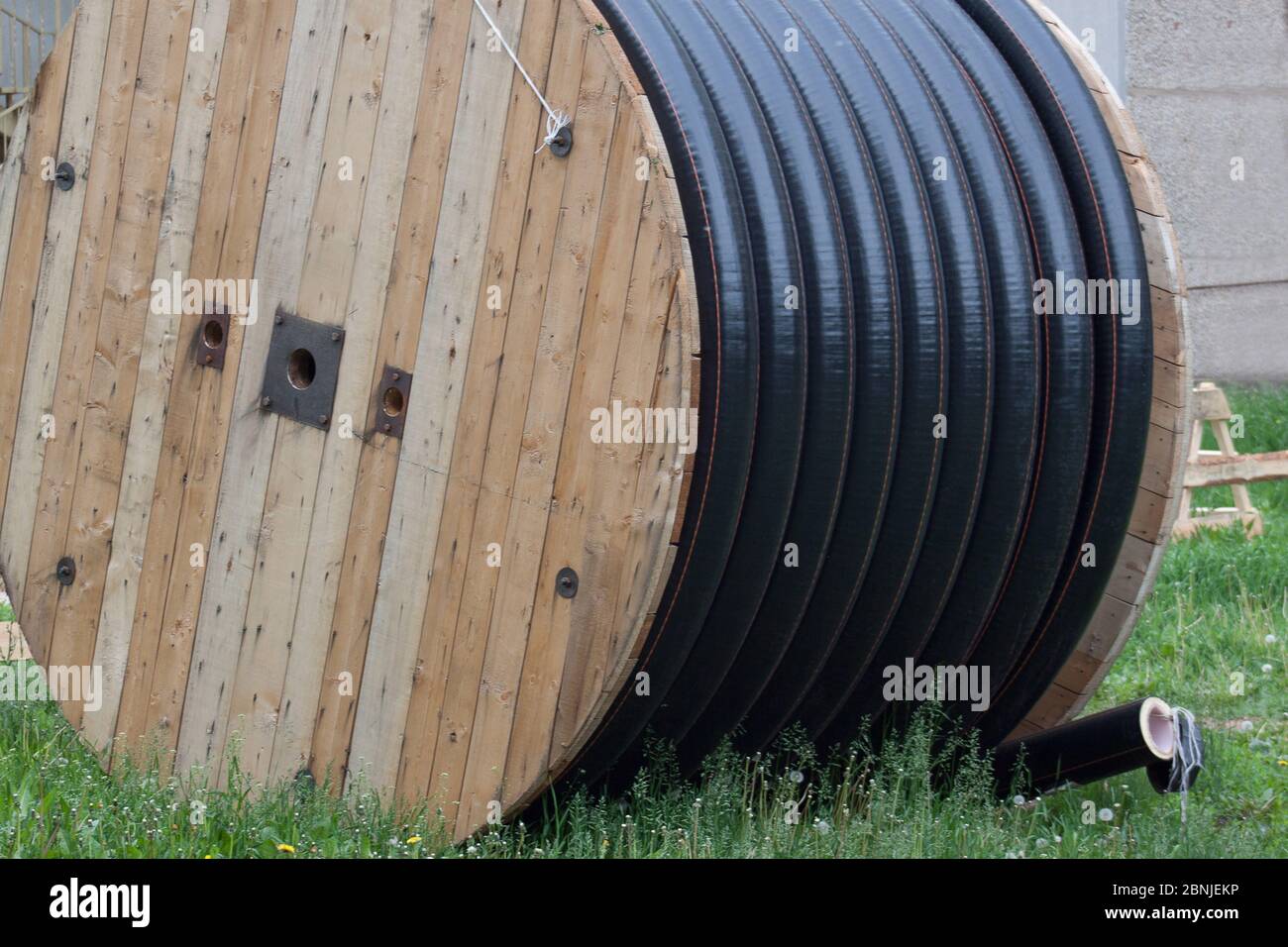 Large polyethylene pipes in the coil for gas and water are liyng on the ...
