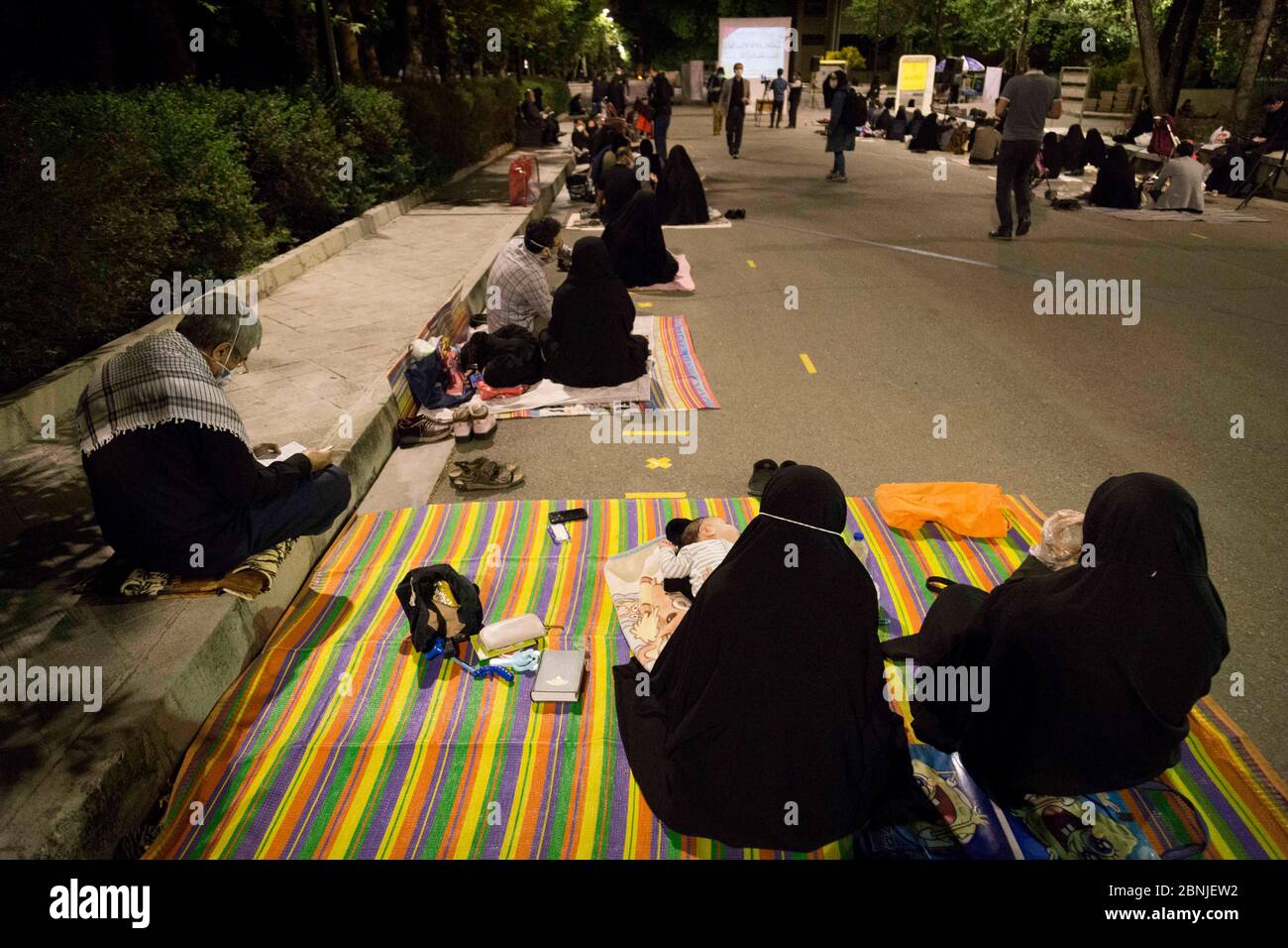 May 14, 2020, Tehran, Iran: Iranians wearing face masks pray during a ...