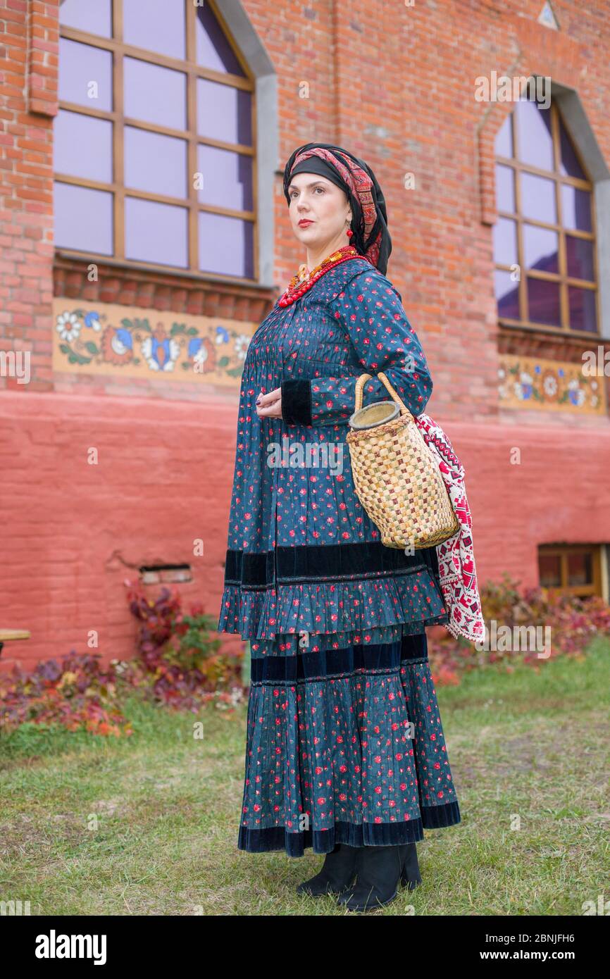 Woman with a basket in retro clothes of the 19th century. Antique ...