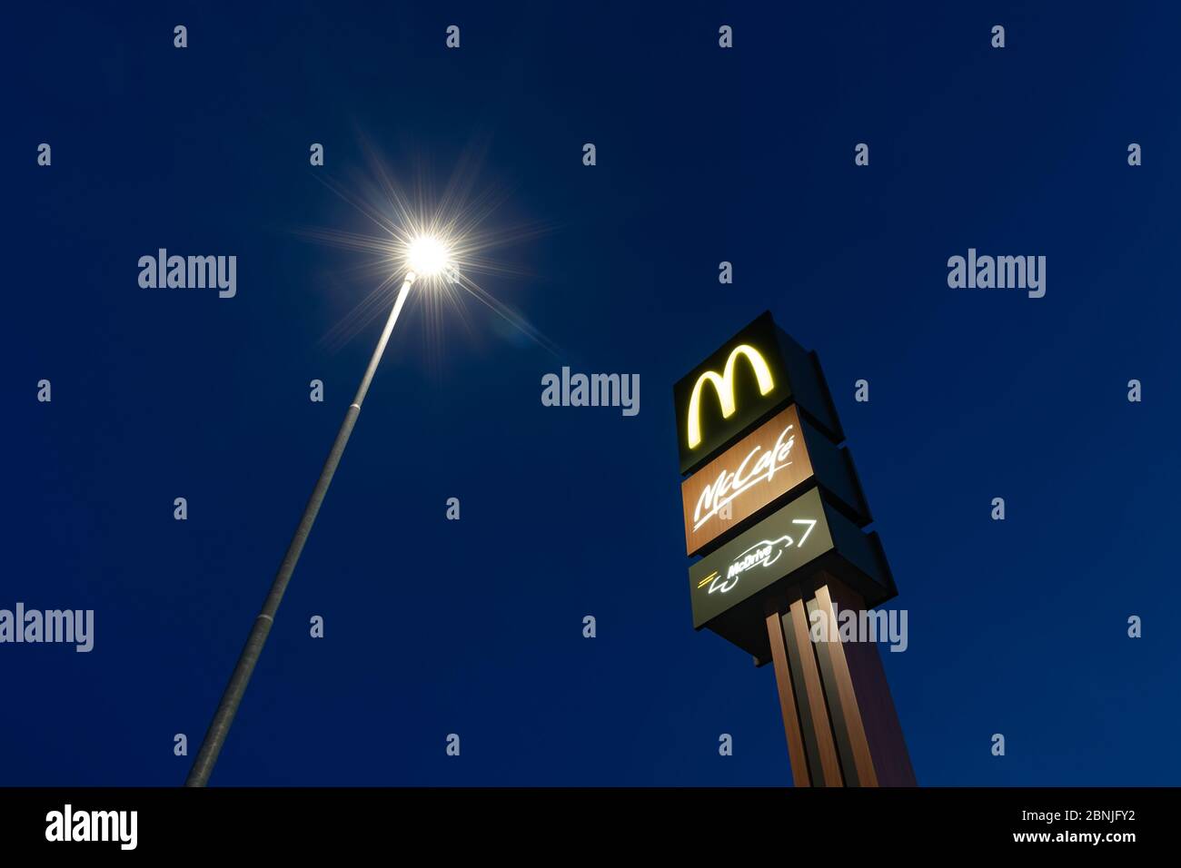 McDonald's and McCafe logos outside fast-food hamburger restaurant at ...