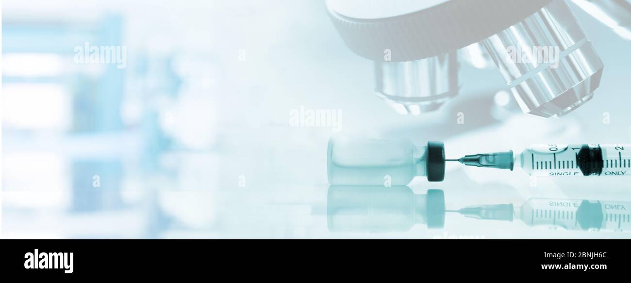 microscope and injection drug bottle and syringe blue soft medical ...