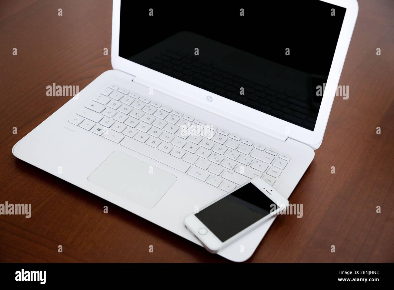 Working from home family devices hi-res stock photography and images ...