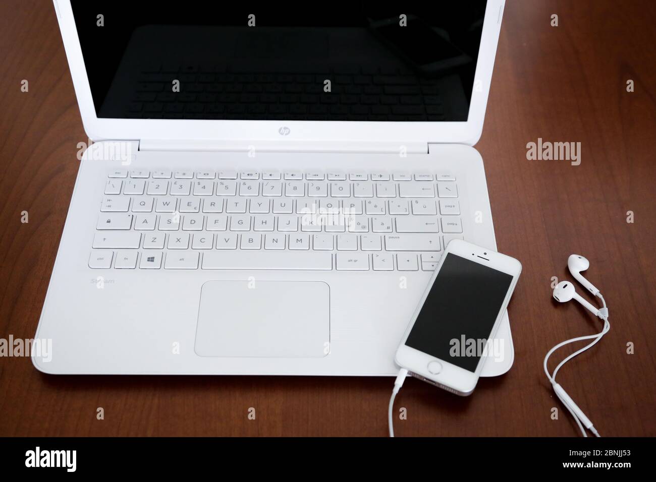 Working from home family devices hi-res stock photography and images ...