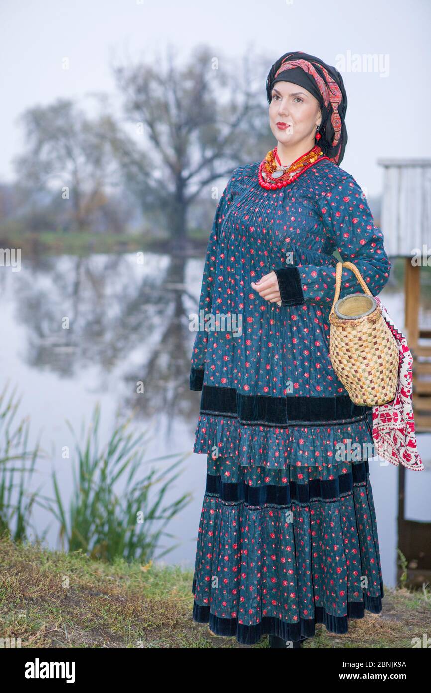 Woman with a basket in retro clothes of the 19th century. Antique ...