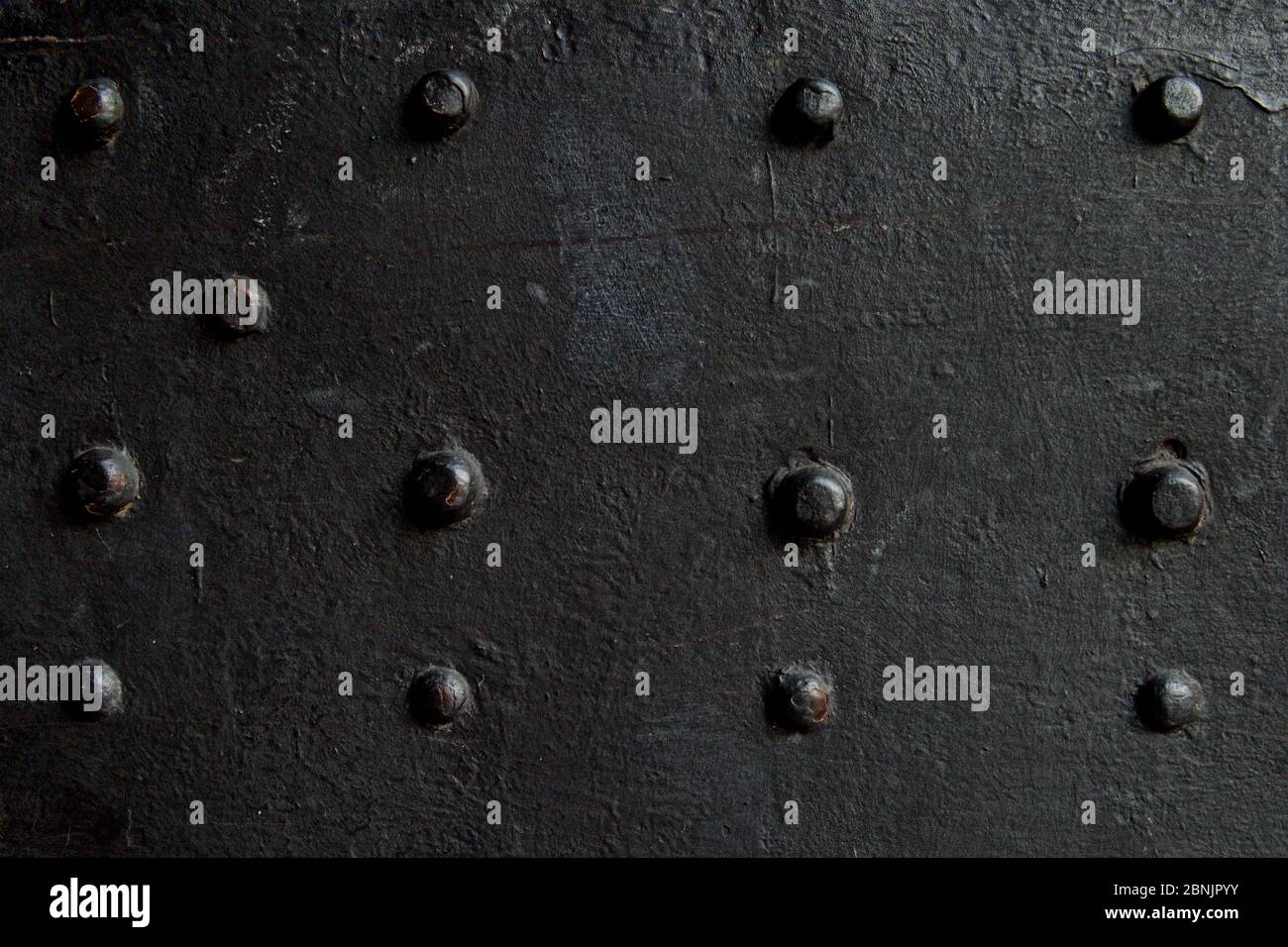 black metal background with rivets Stock Photo - Alamy