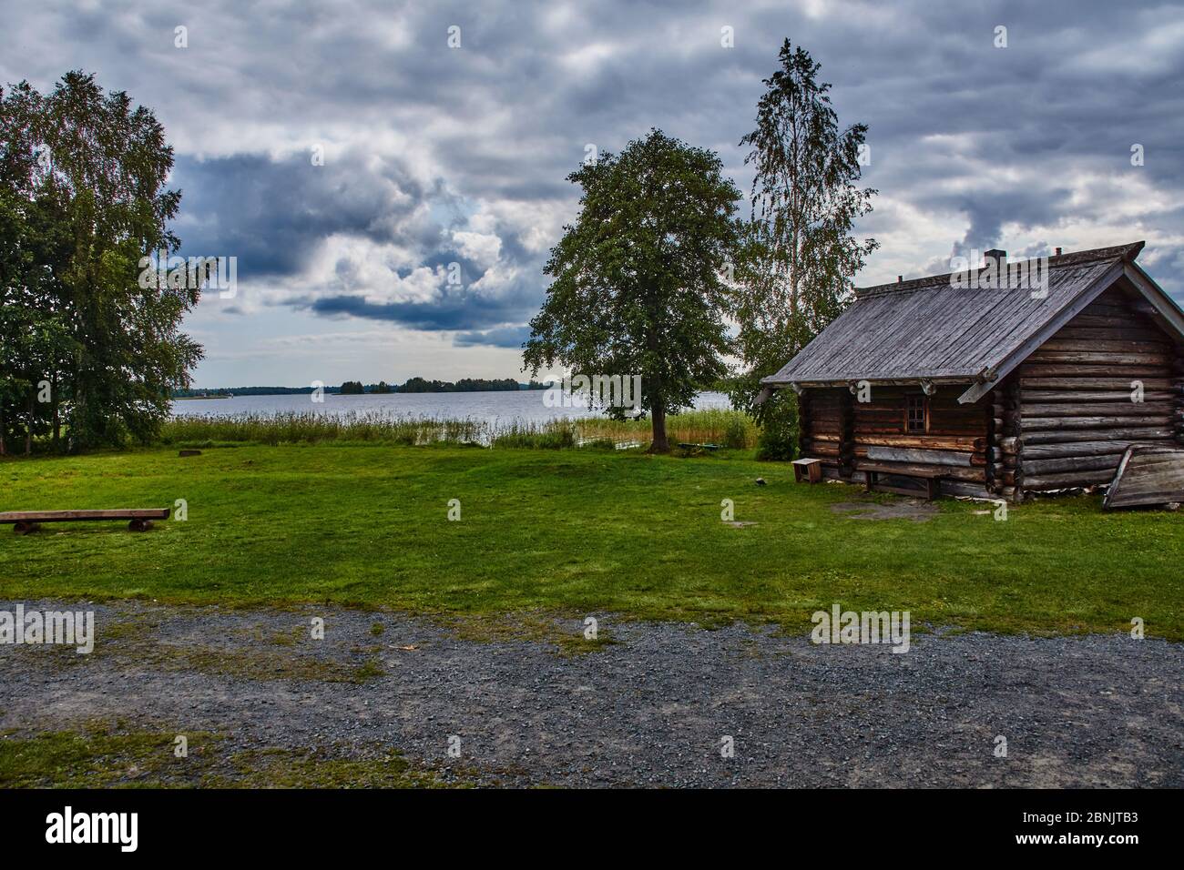 A large wooden house is used to store fishing boats. You can see the ...