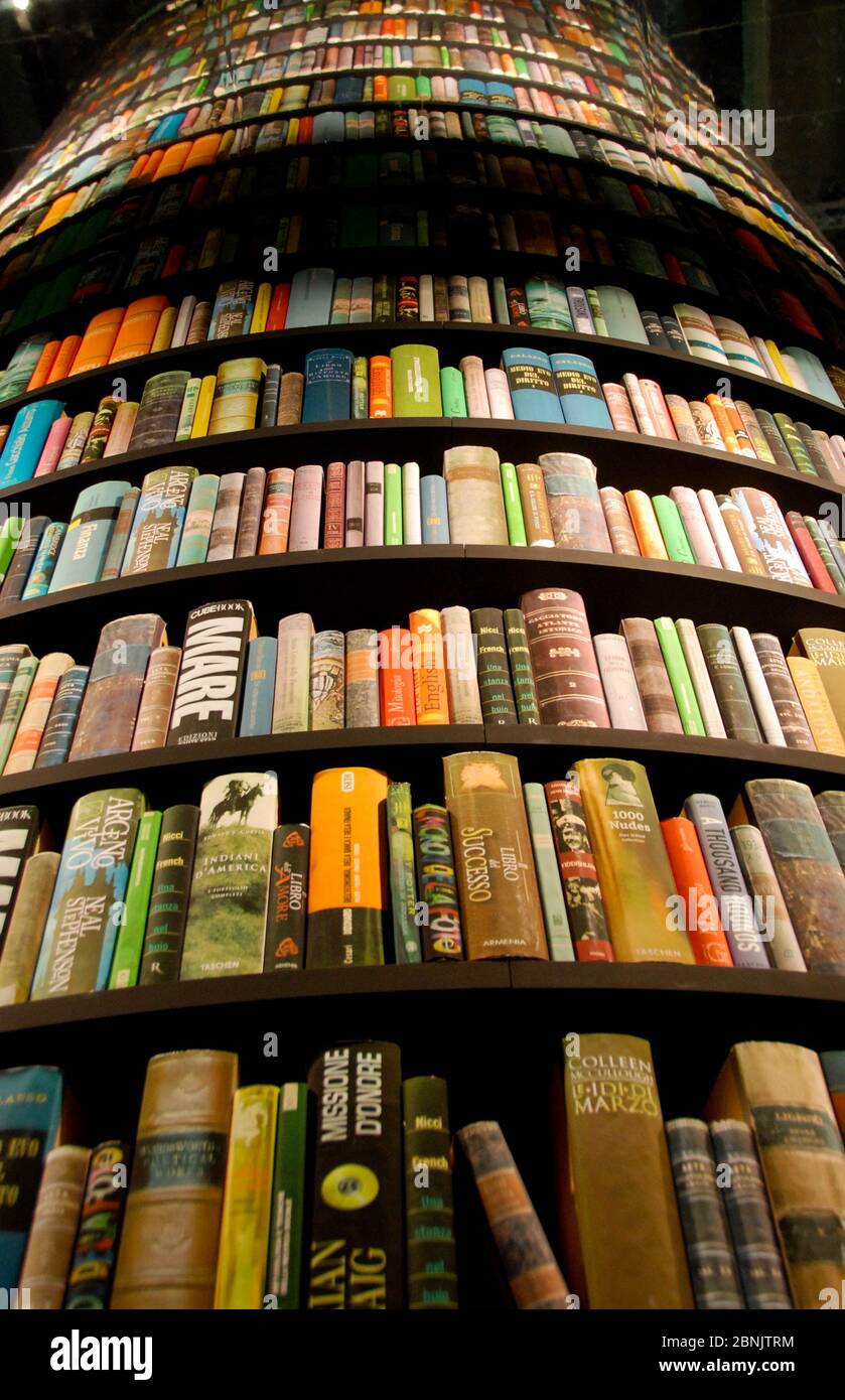 Books in a tower-shaped bookcase Stock Photo - Alamy